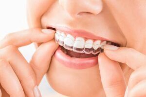 How to Deal With Invisalign Pain: 10 Dentist-Approved Tips